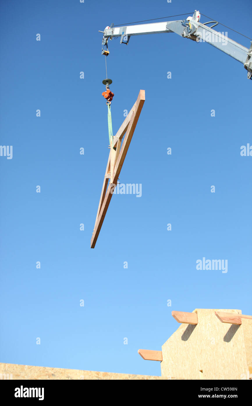 crane lifting wooden frame Stock Photo - Alamy