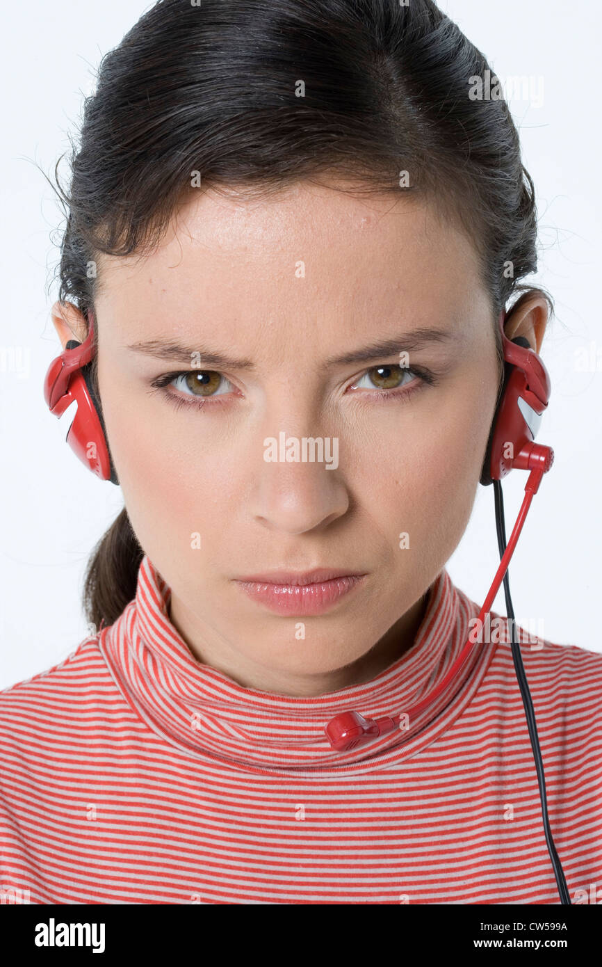 Portrait of a female customer service representative wearing a headset ...