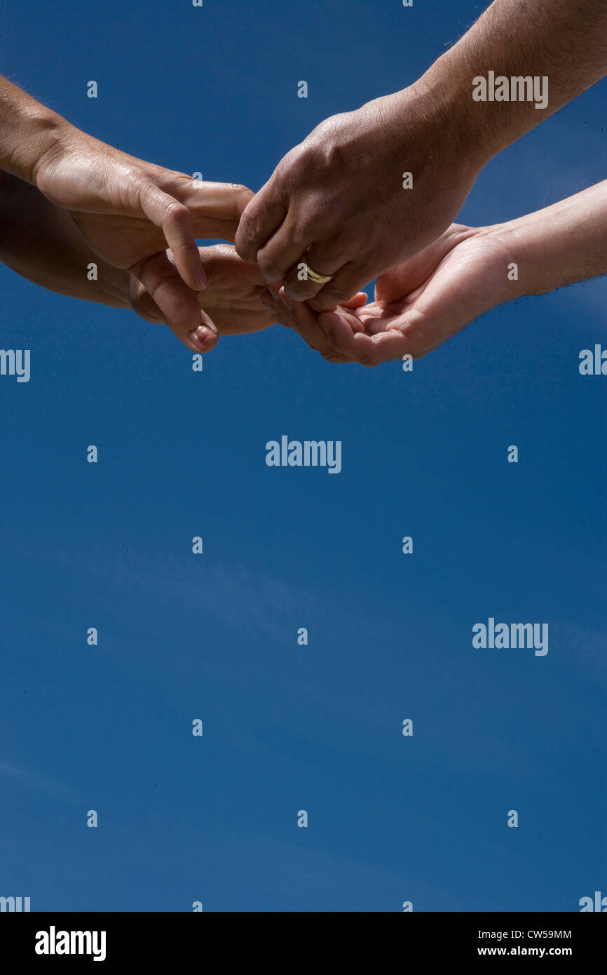 Low angle view of a couple holding hands Stock Photo - Alamy
