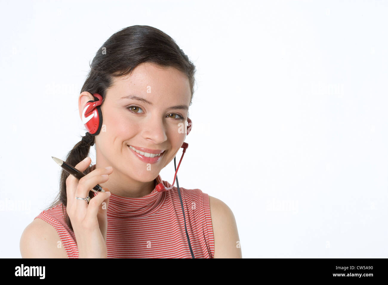 Portrait of a female customer service representative wearing a headset ...