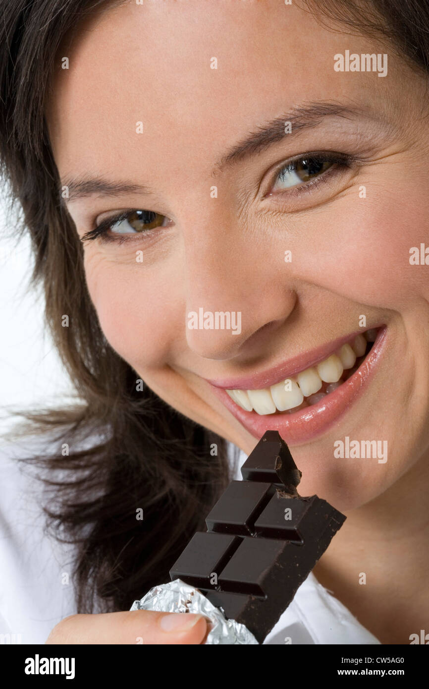 Woman eating a chocolate sweet hi-res stock photography and images - Alamy