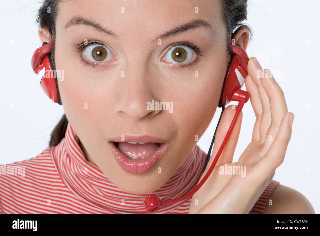 Portrait of a female customer service representative wearing a headset ...