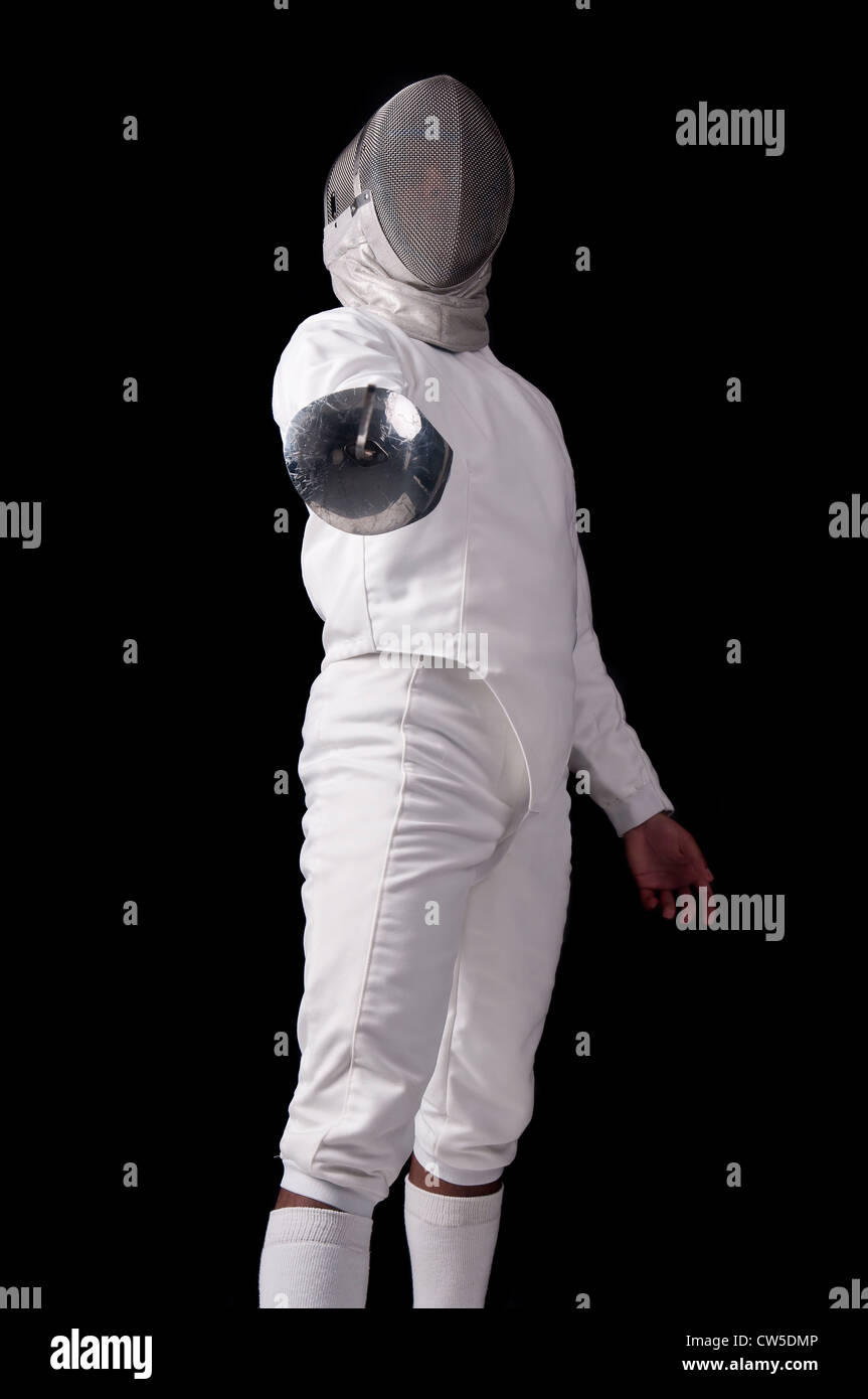 Male fencer isolated in a dark background Stock Photo - Alamy