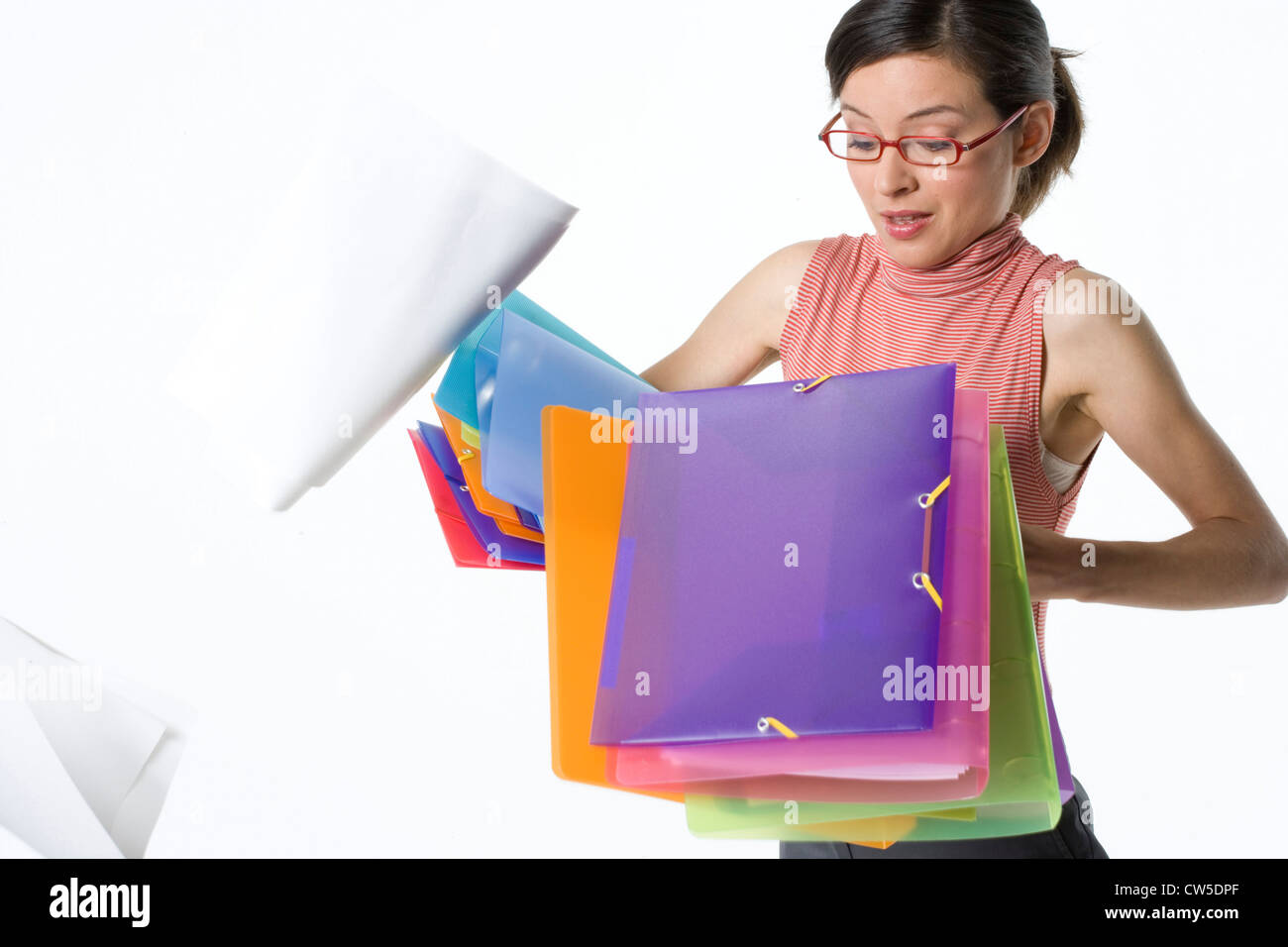 Stack of ring binders falling from a businesswoman's hands Stock Photo ...