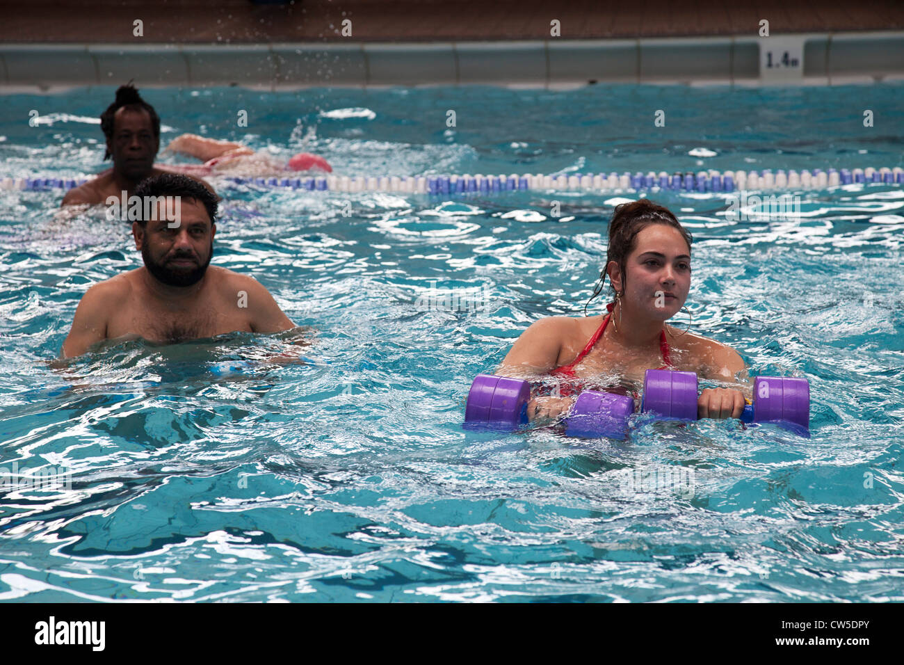 Exercise class at Cally Pool swimming pool, London. People join the ...