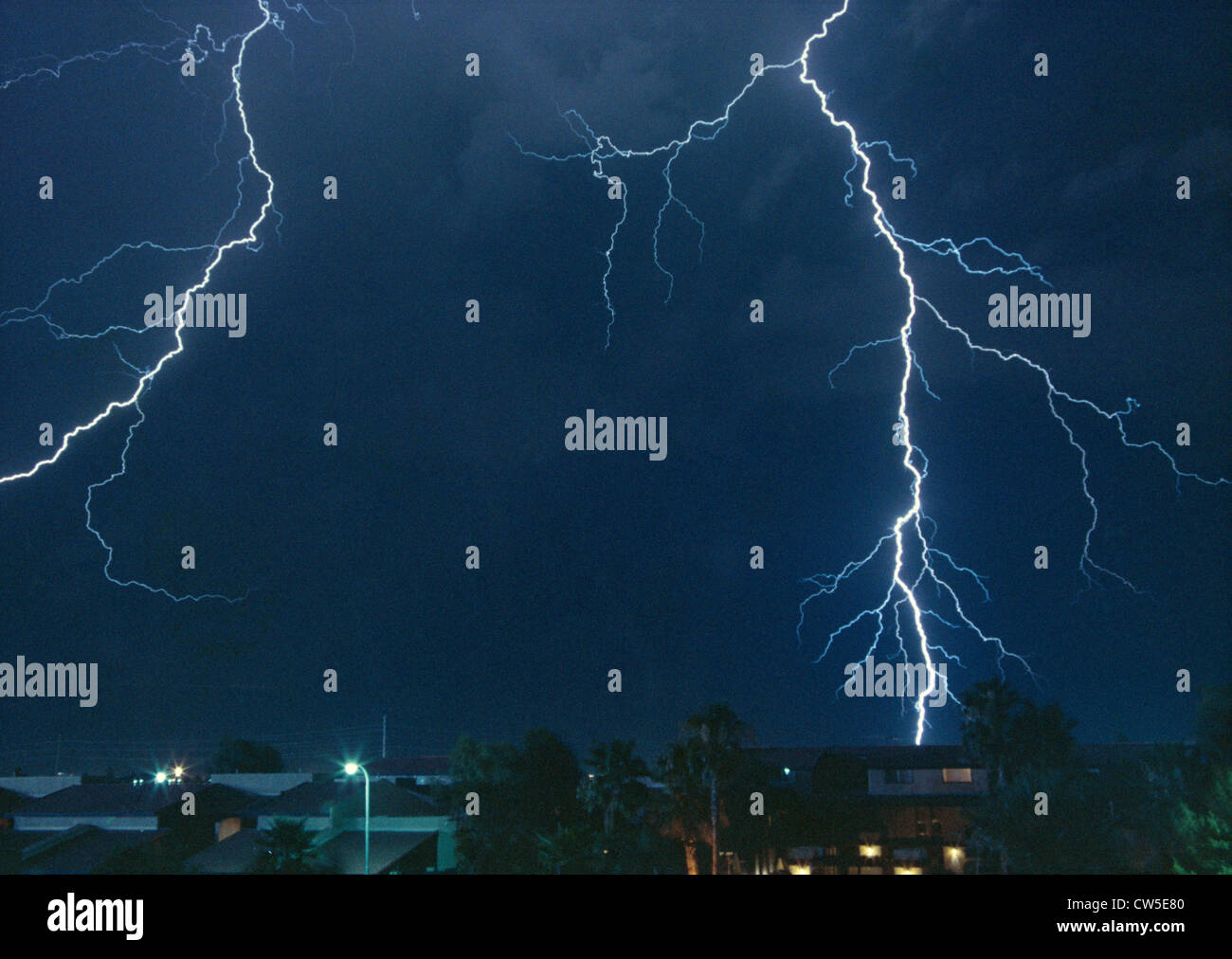 Lightning bolts striking the city Stock Photo - Alamy