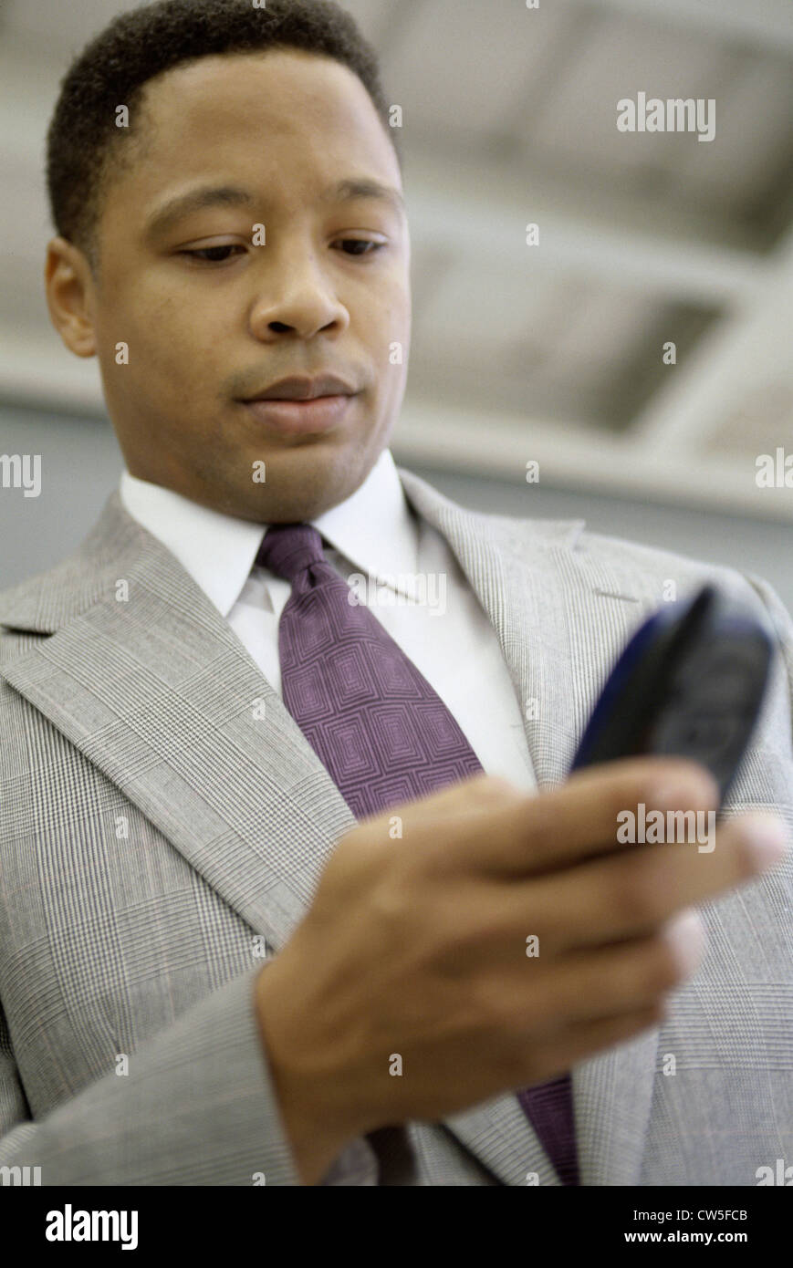 Businessman operating a mobile phone Stock Photo - Alamy