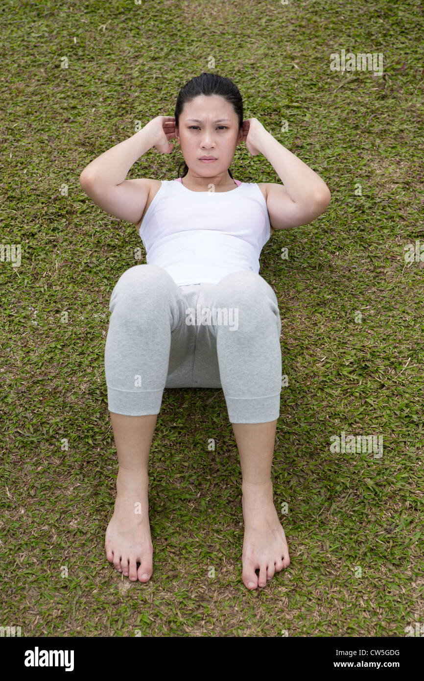 Chinese woman doing sit ups hi-res stock photography and images - Alamy