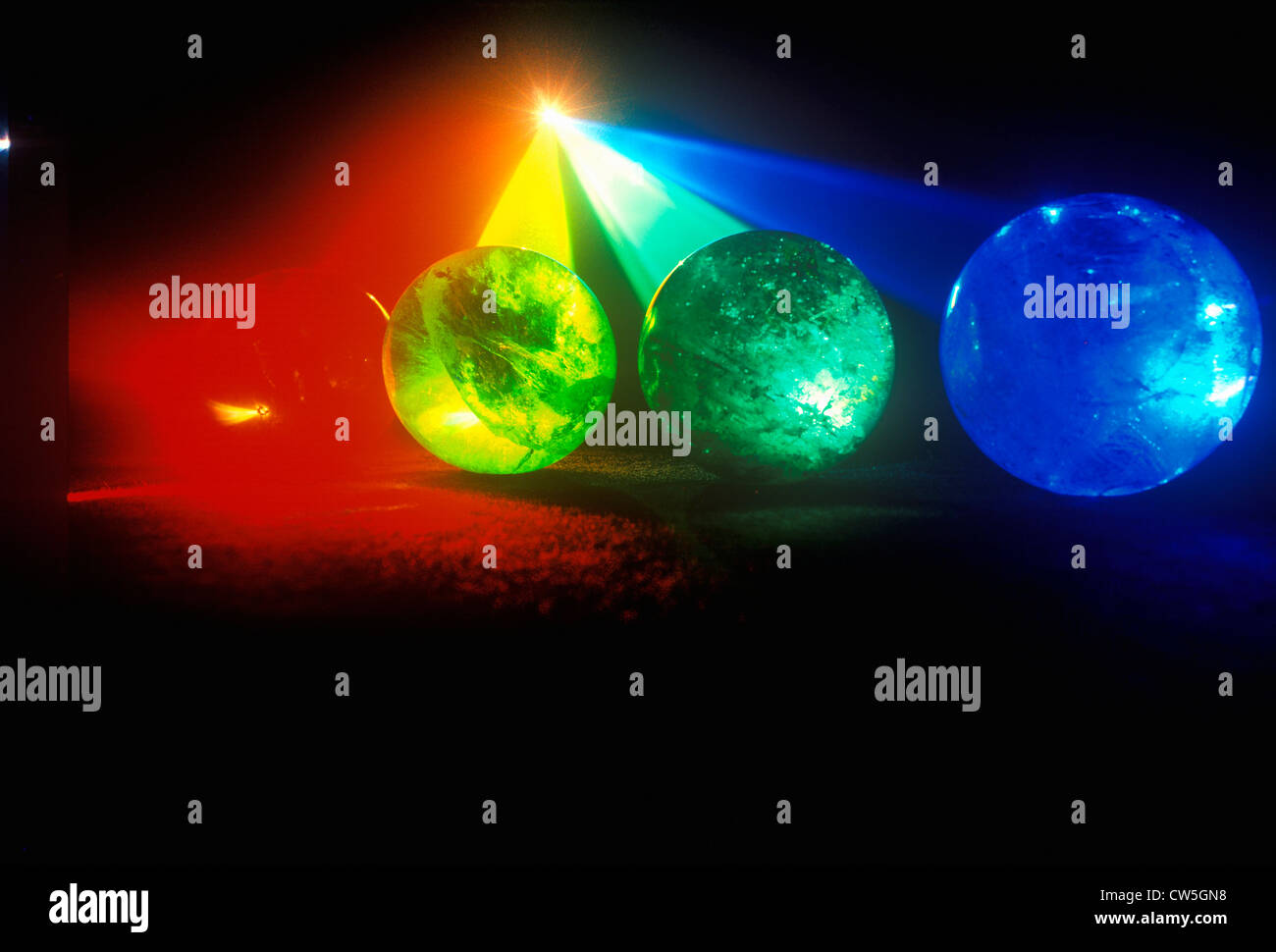 Several multi-colored spheres appearing as planets with laser lights ...