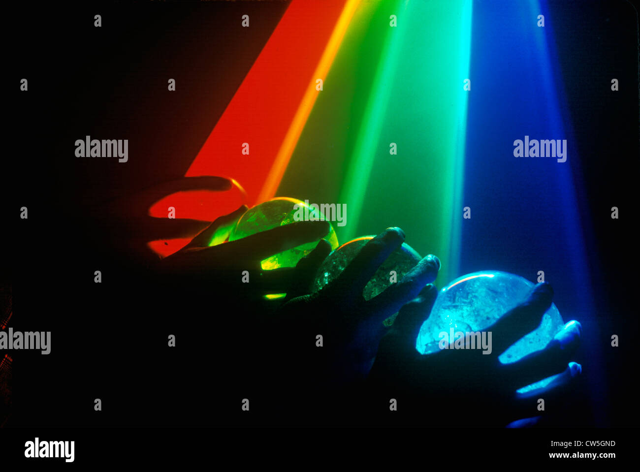 Several multi-colored spheres appearing as planets with laser lights ...