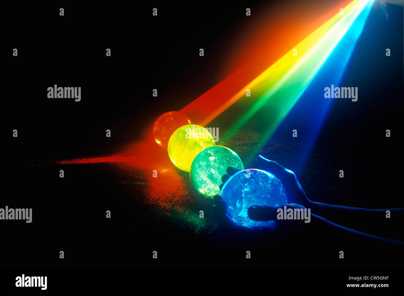 Several multi-colored spheres appearing as planets with laser lights ...
