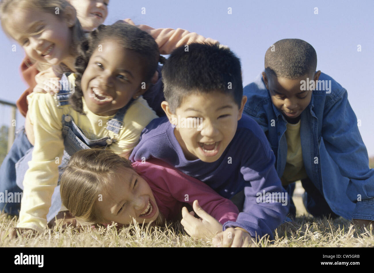 Portrait of a group of children playing together Stock Photo - Alamy