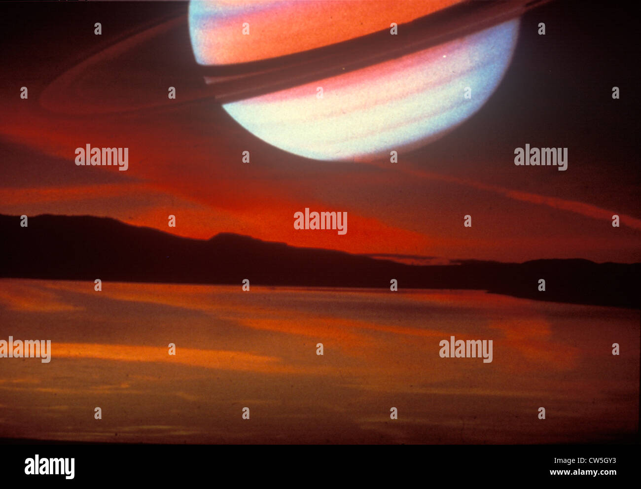 Saturn superimposed on a cloudy sunset sky Stock Photo - Alamy