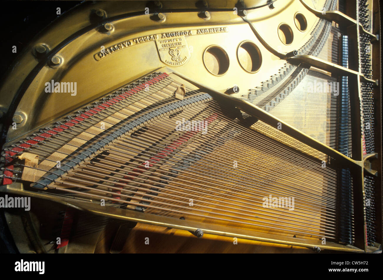 Strings inside an antique grand piano Stock Photo - Alamy