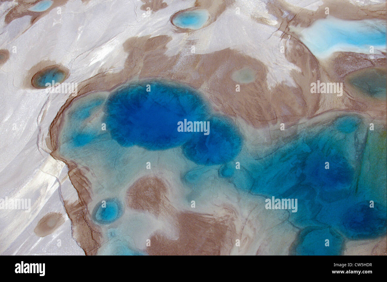 Aerial view of silt and turquoise water in an Alaska glacier, Alaska ...