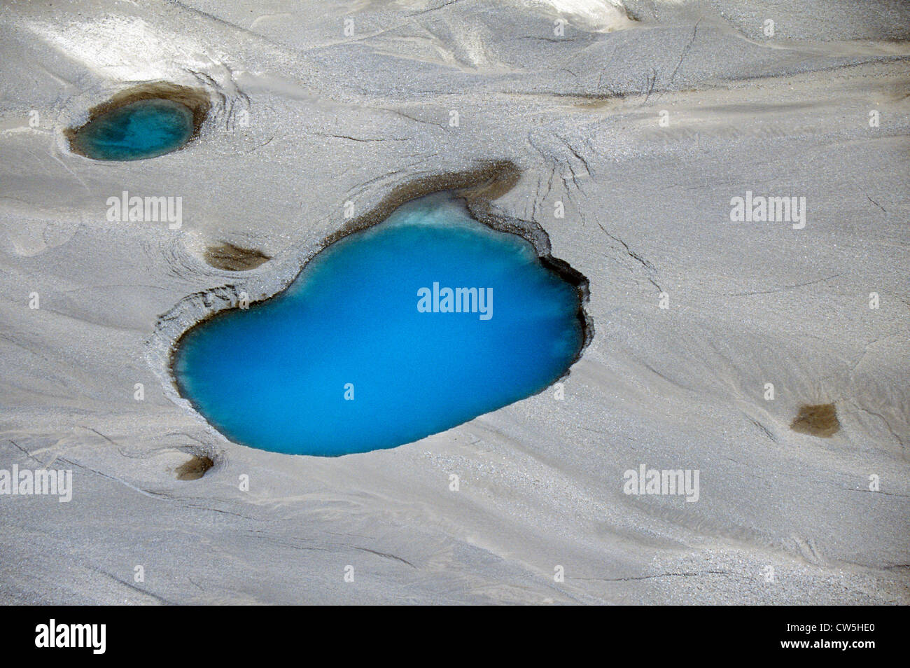 Aerial view of silt and turquoise water in an Alaska glacier, Alaska ...