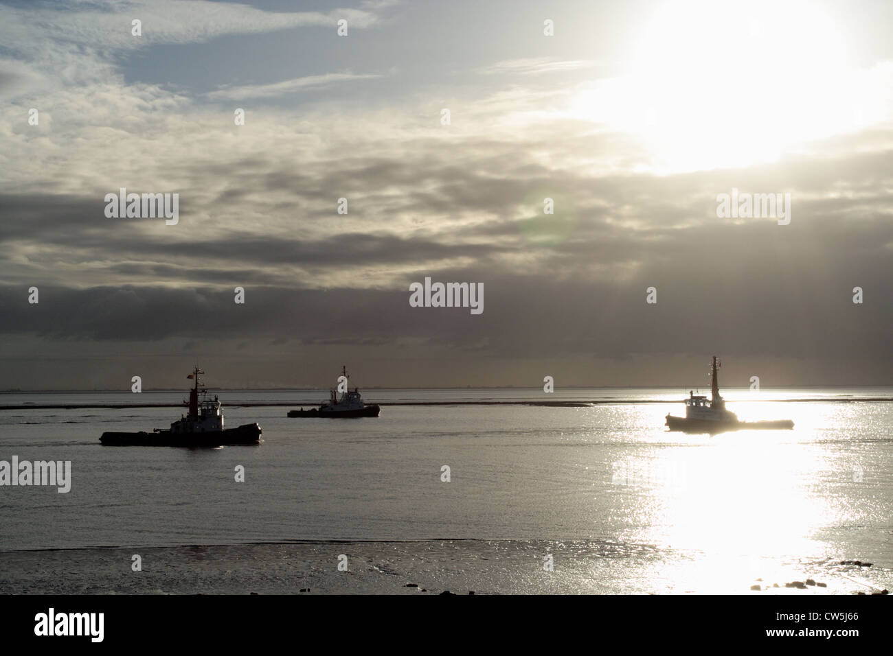 Emden, three tugs on the river Ems Stock Photo - Alamy