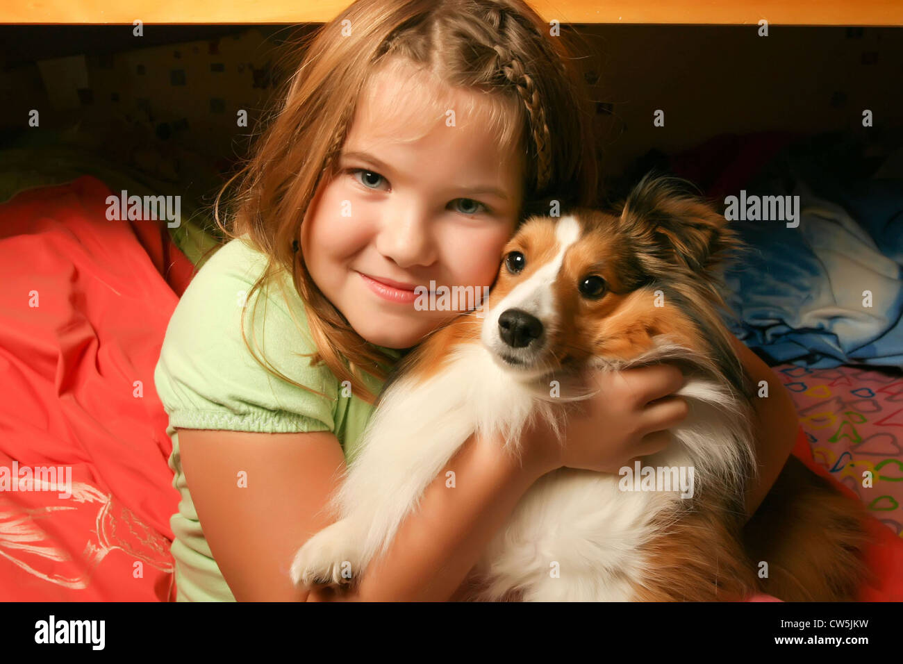 Girl hugging her dog and smiling Stock Photo - Alamy