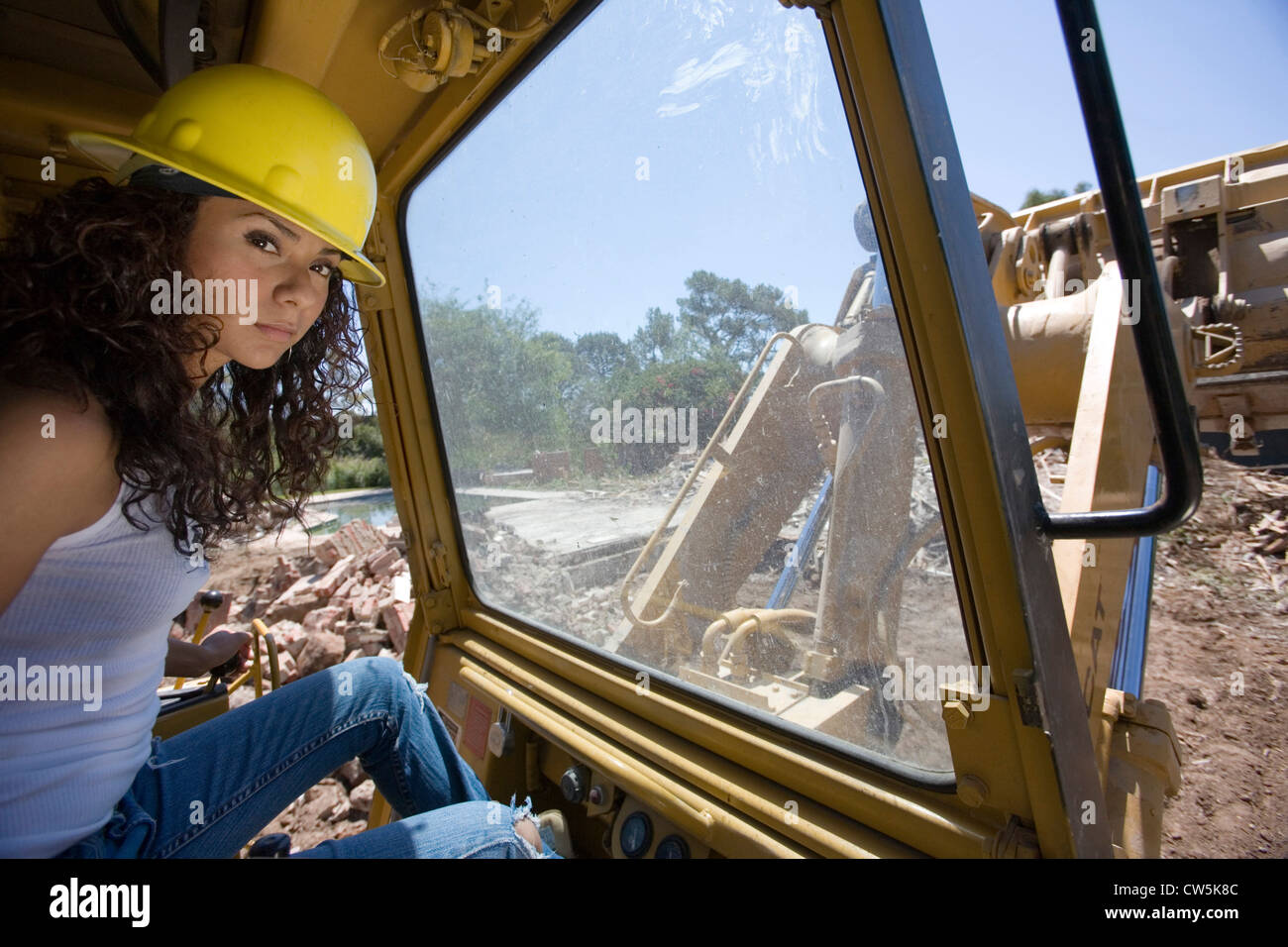Female construction worker operating a bulldozer Stock Photo - Alamy