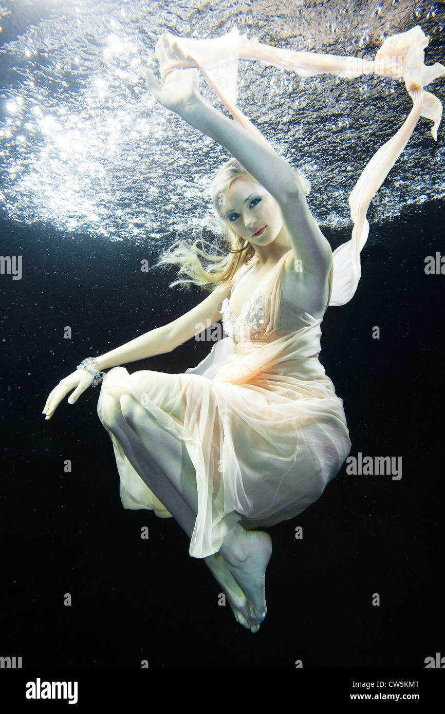 Young woman underwater Stock Photo - Alamy