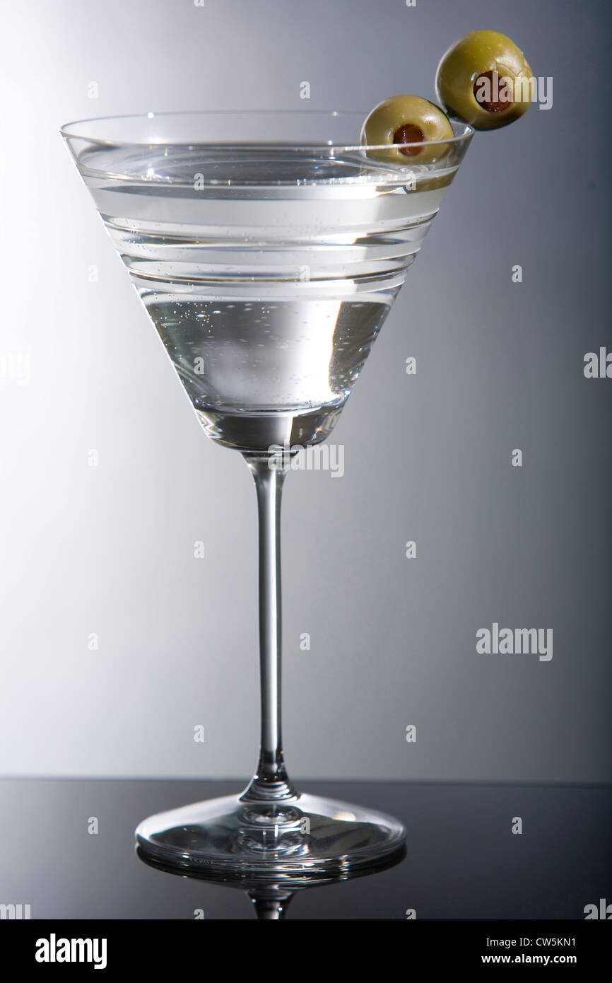 Martini with green olives Stock Photo - Alamy