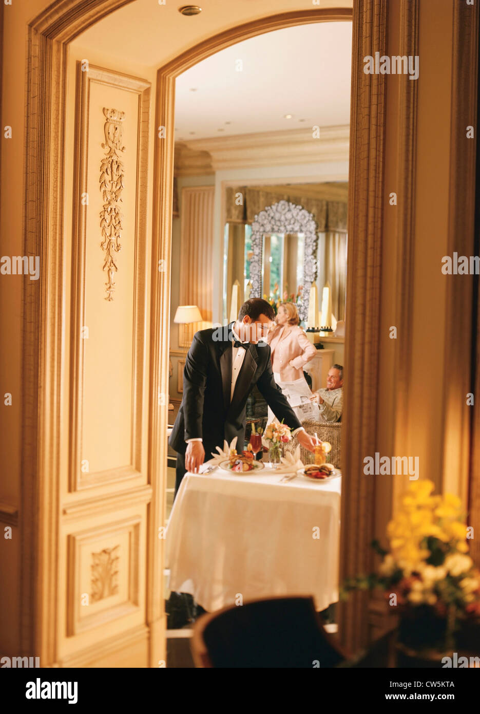 Waiter serving food in a hotel room Stock Photo - Alamy