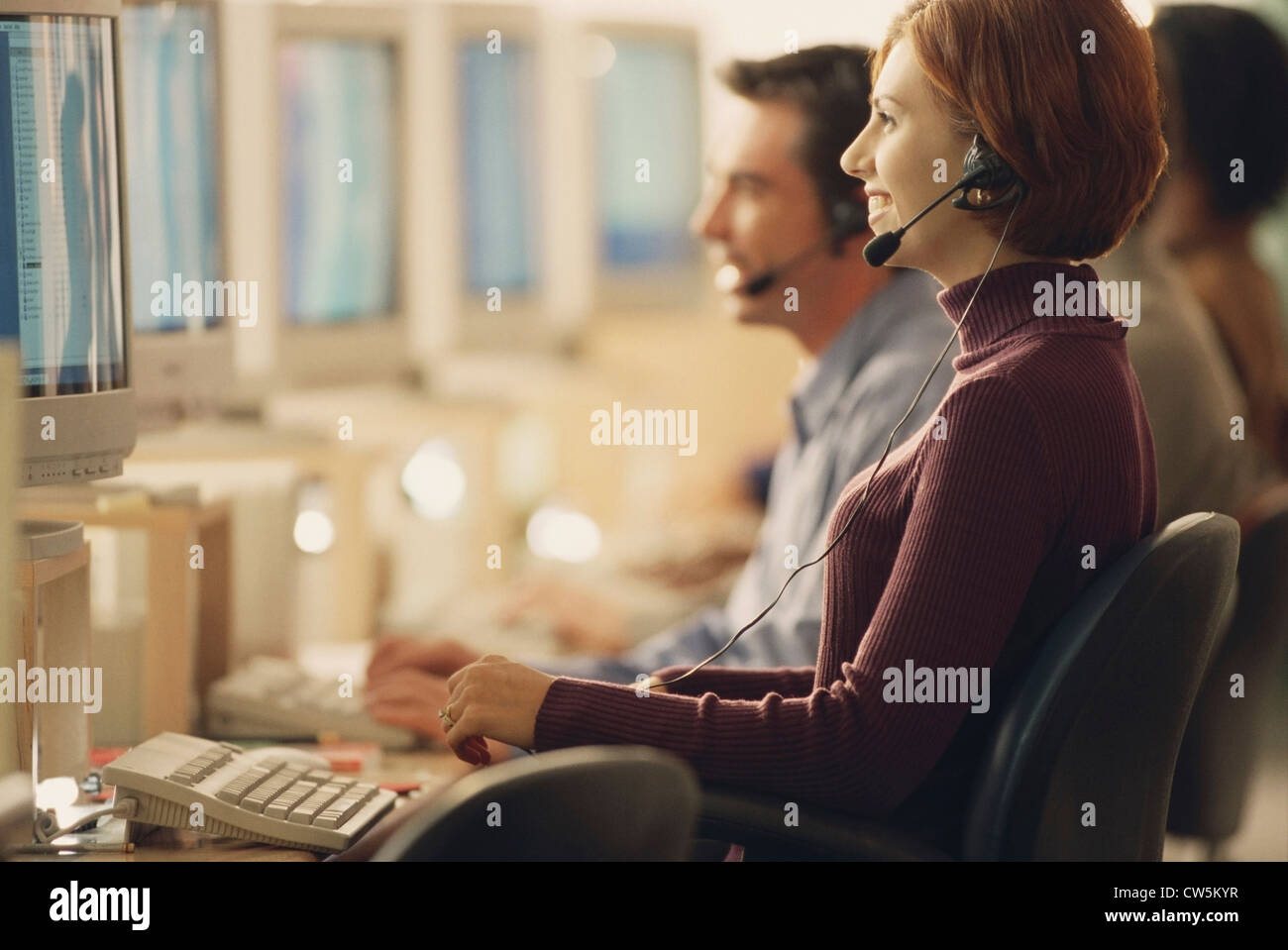 Customer service representatives working in an office Stock Photo - Alamy