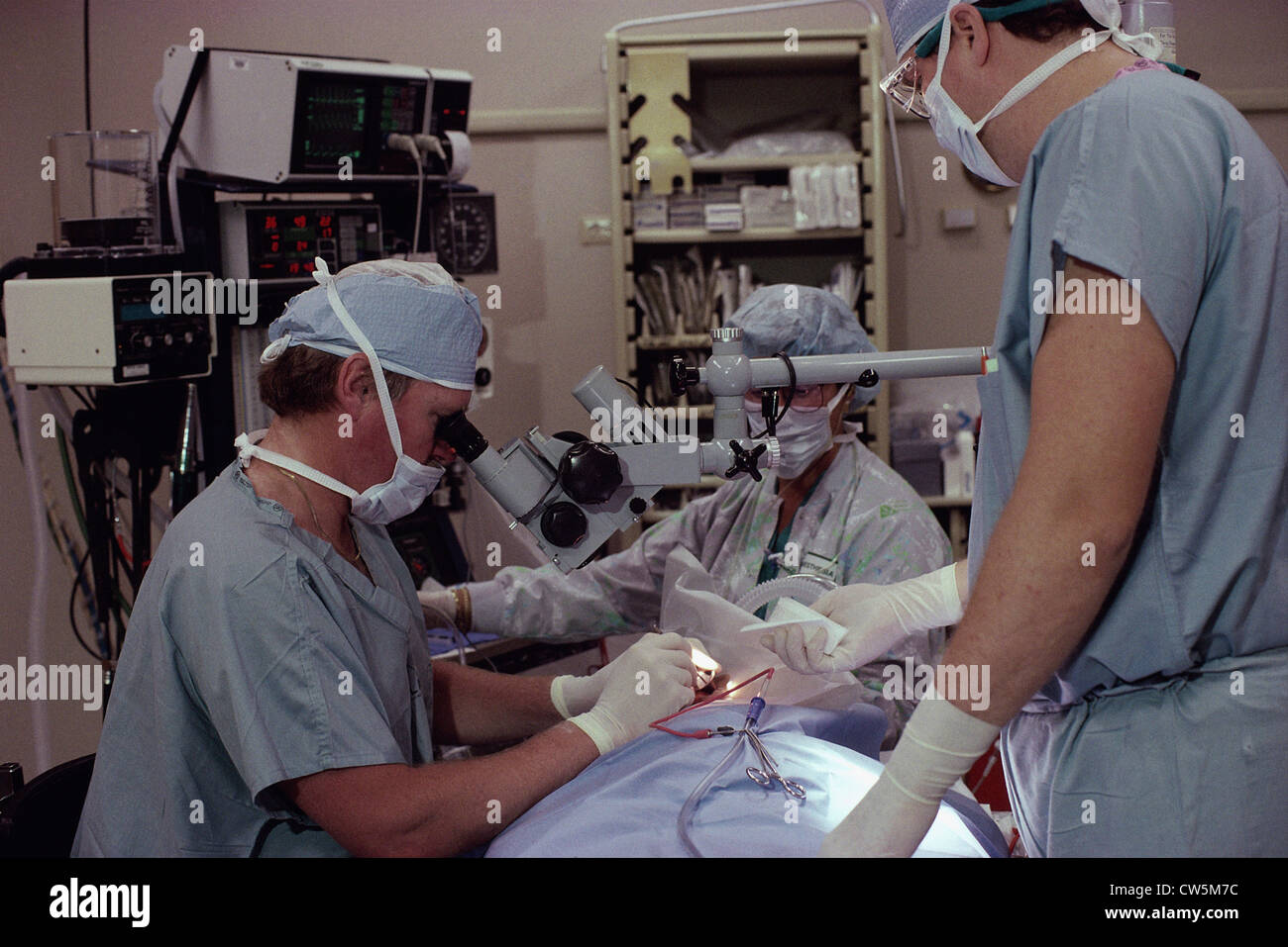 Surgeons operating in an operating room Stock Photo - Alamy