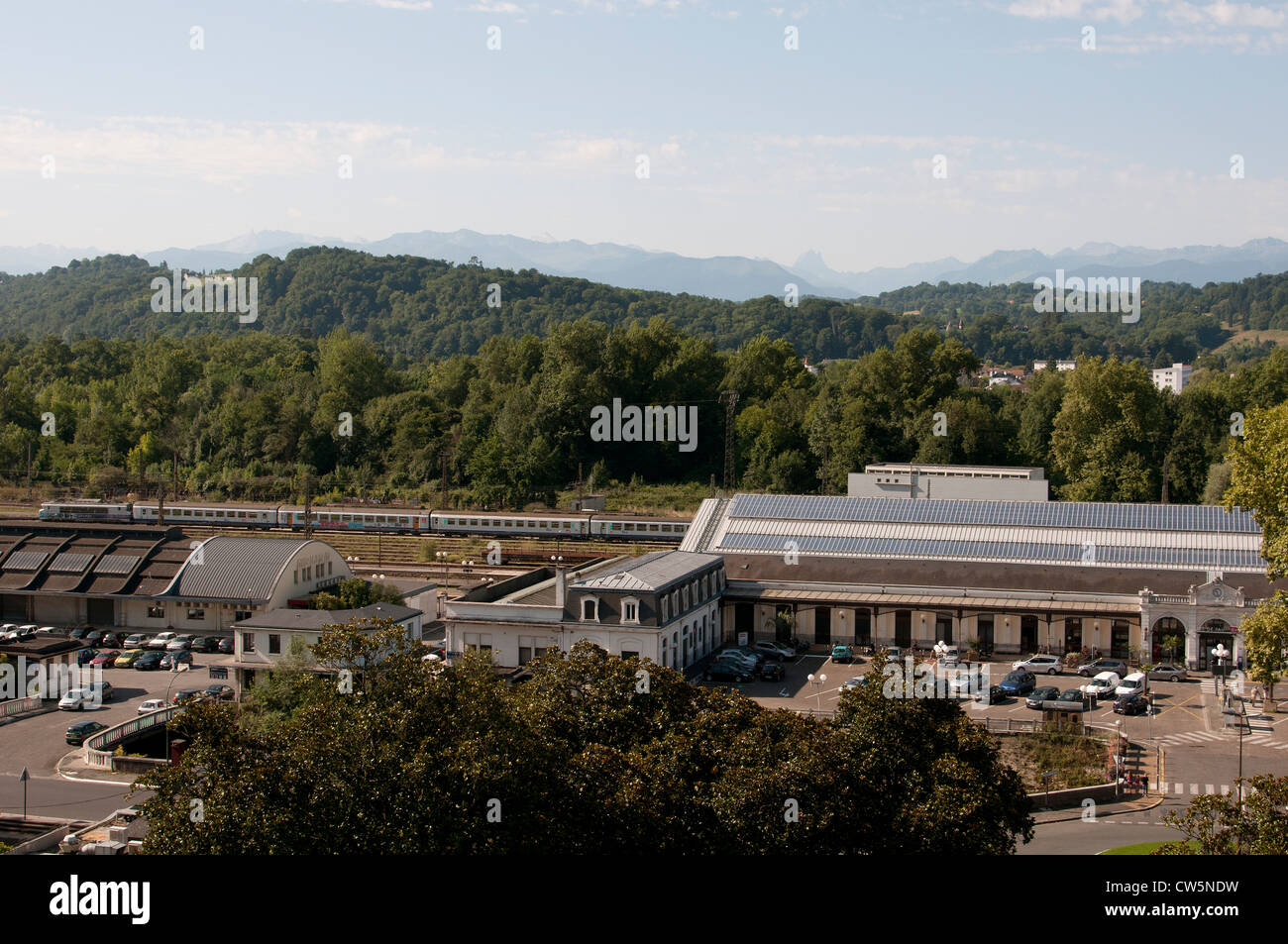 French Pyrenees mountains backdrop beyond SNCF railway station at Pau ...