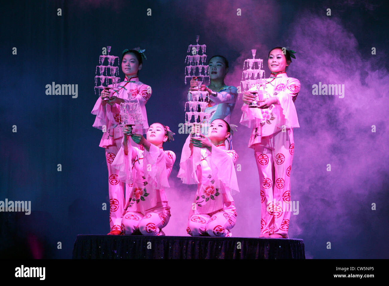 Beijing Artists balance with glasses Stock Photo - Alamy