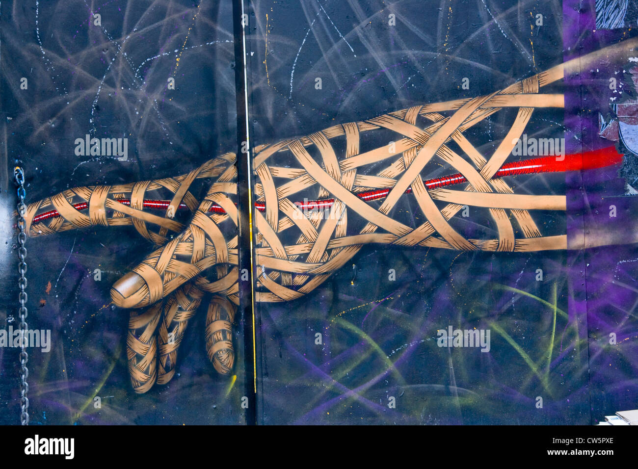 Urban graffiti street art of hand arm and artery on gates Hanbury ...