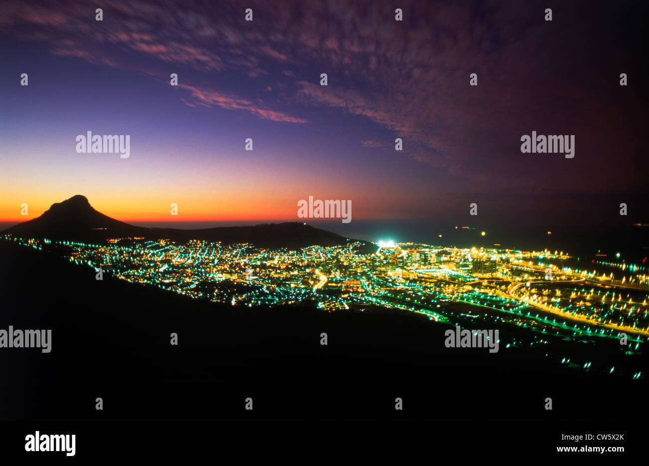 City lights of Cape Town and Table Bay at twilight from Table Mountain ...