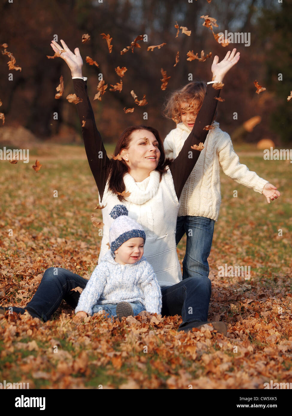 Mother with two children Stock Photo - Alamy