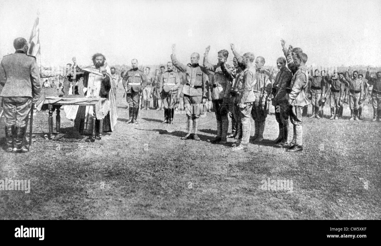 World War I. Serb volunteers pledging oath before flag Orthodox priest ...