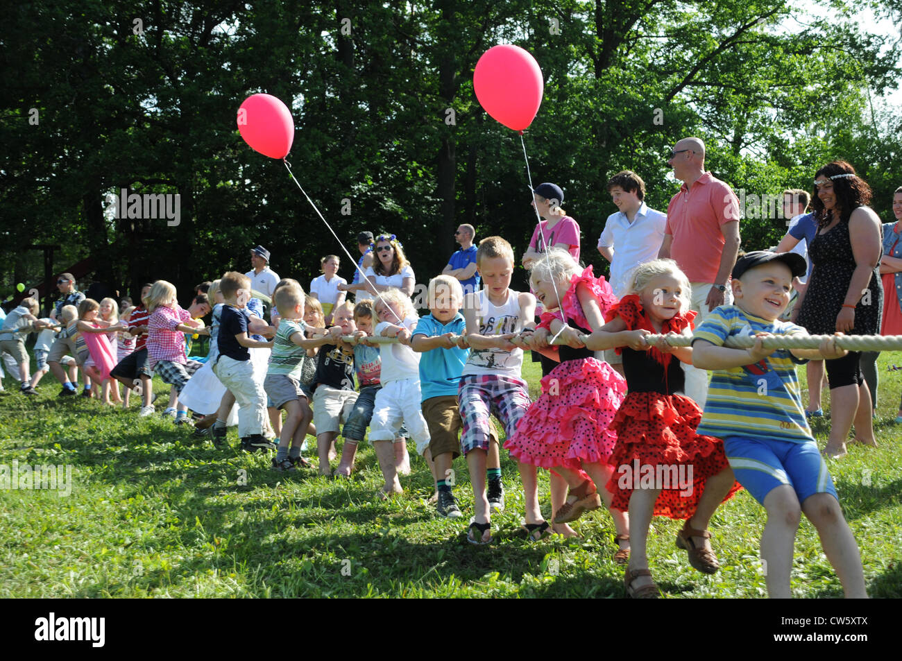 KIds playing tug-of-war games during Midsummer Celebrations in Sweden ...