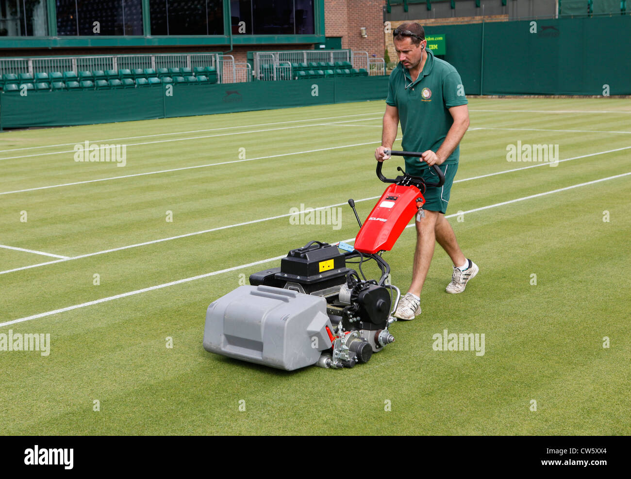 Groundkeeper cutting the lawn at the Wimbledon Championships Stock ...