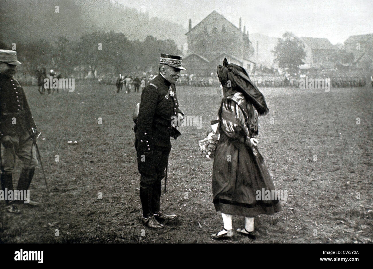 World War I. An Alsatian girl giving a bouquet to General Maud'Huy ...
