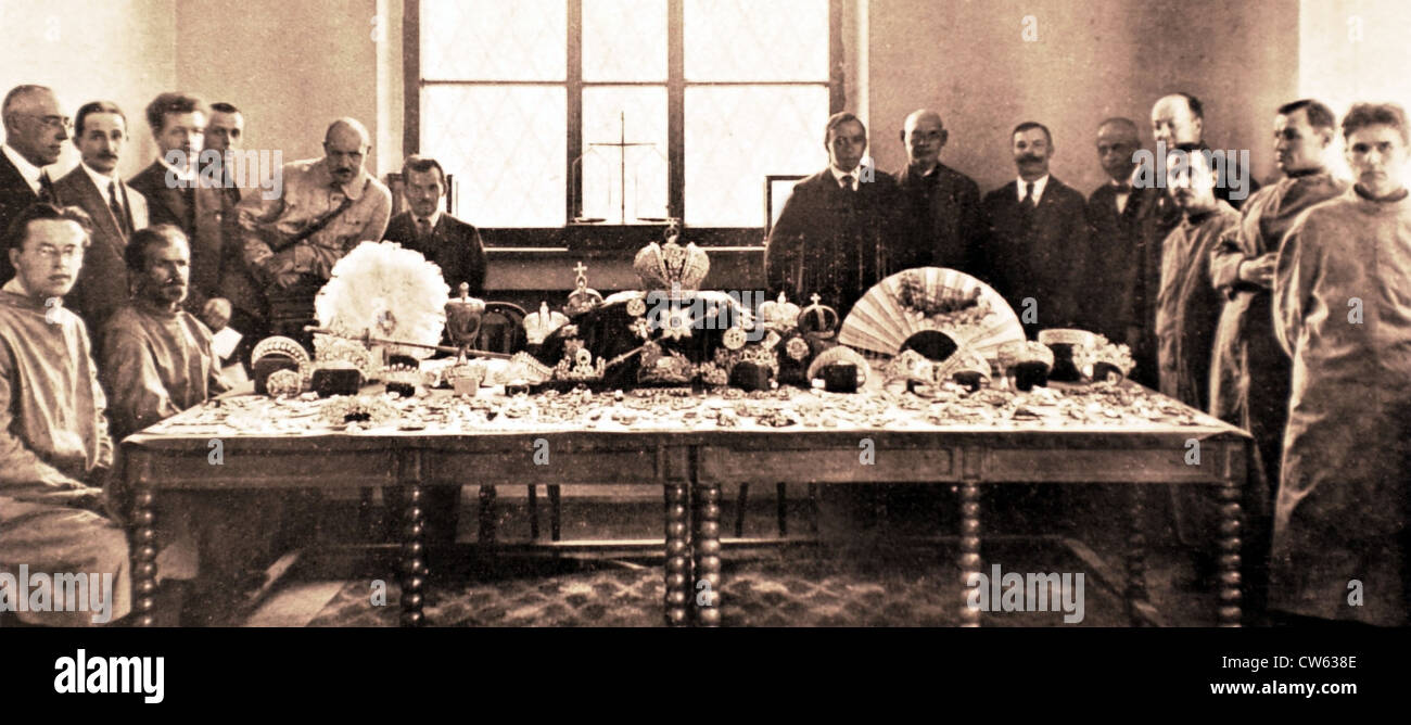 Russian Imperial crown jewels displayed on a table around which is ...