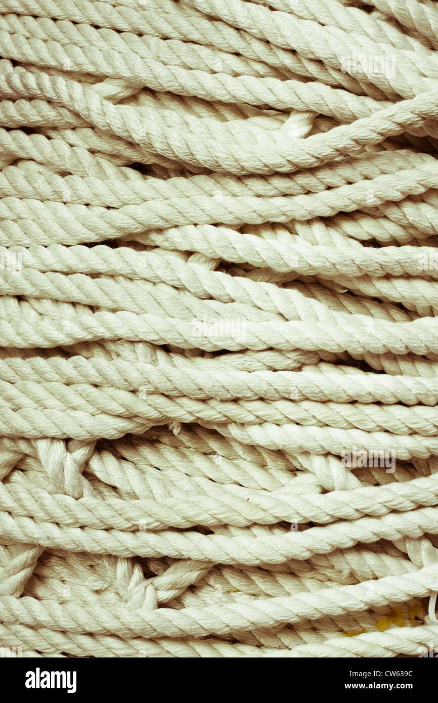 Rope tied loosely in an untidy way as a background image Stock Photo ...