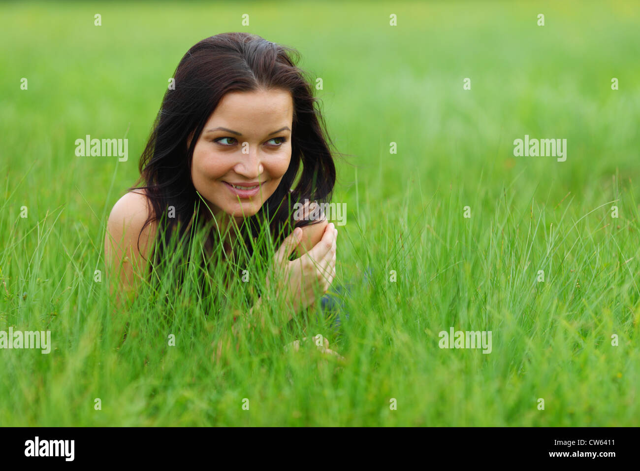 woman on grass in green fields Stock Photo - Alamy