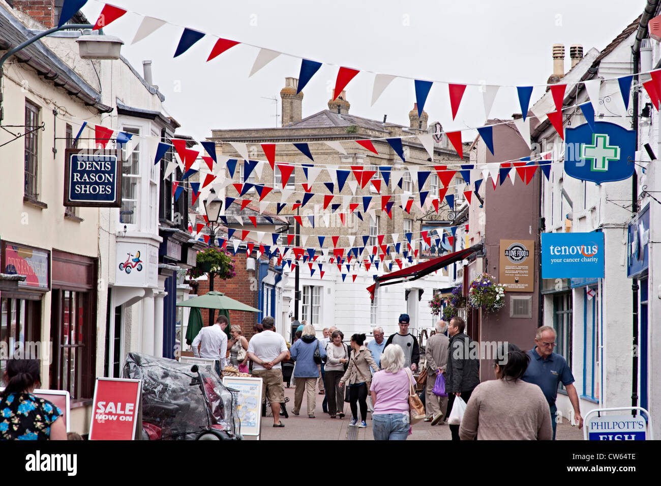 hythe in new forest on high street with shops and bunting for the ...