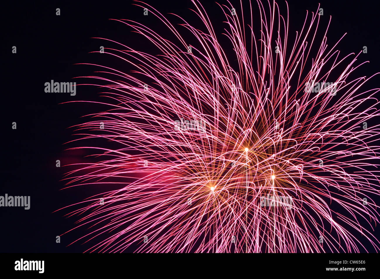 Three pink fireworks Stock Photo - Alamy