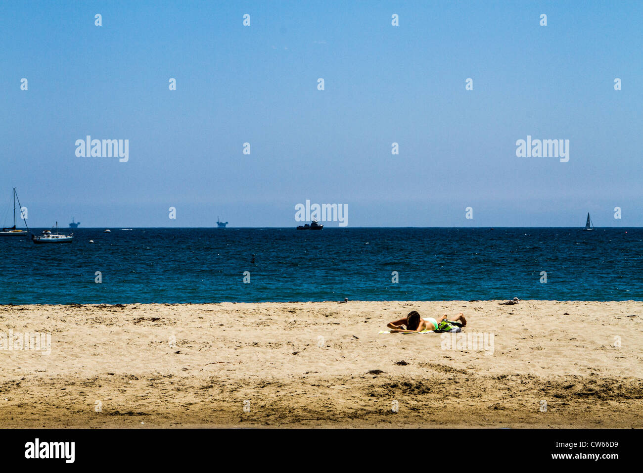 A sunbather on the beach in Santa Barbara California Stock Photo - Alamy