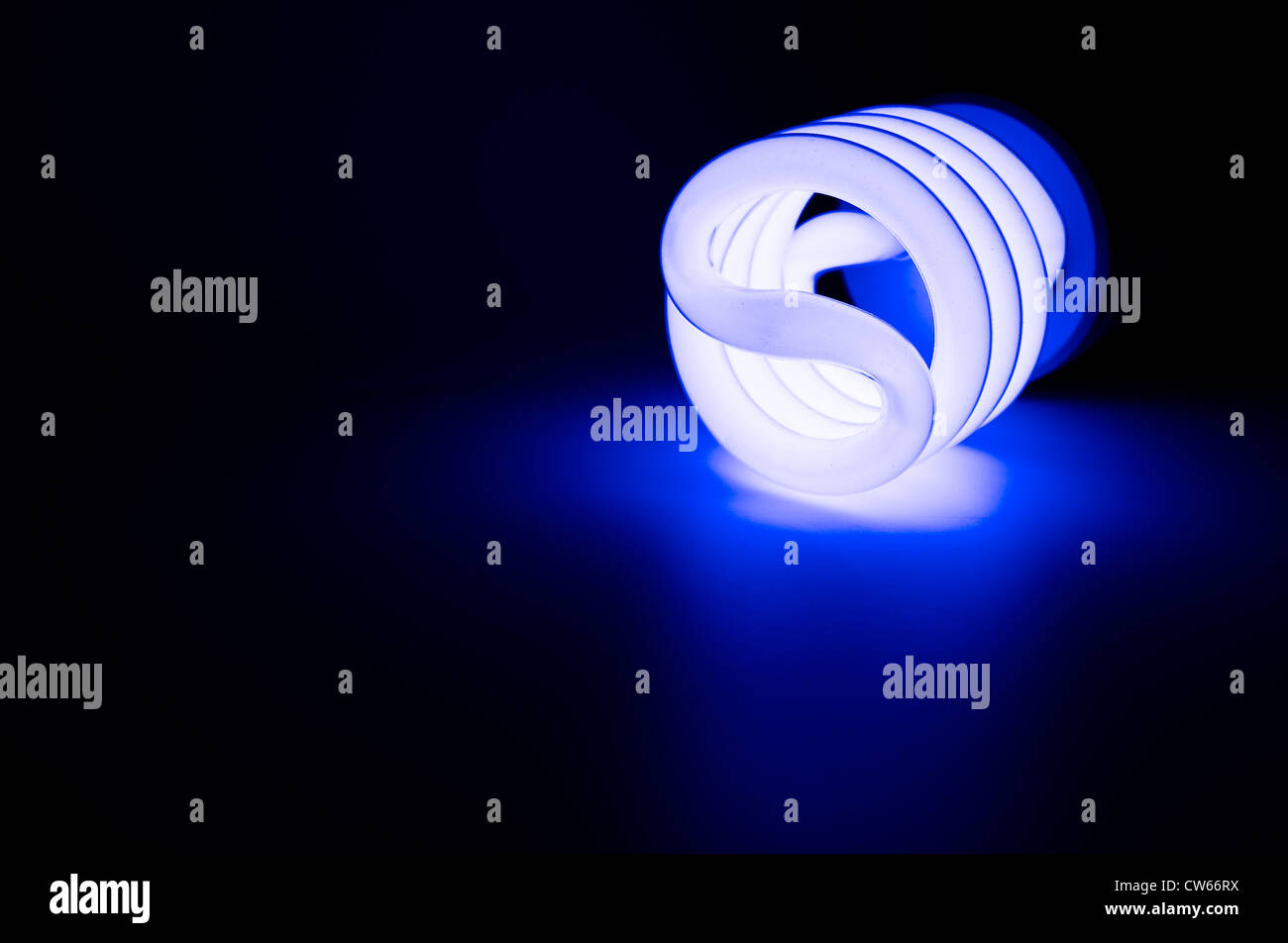 Blue light florescent bulb in the dark Stock Photo - Alamy