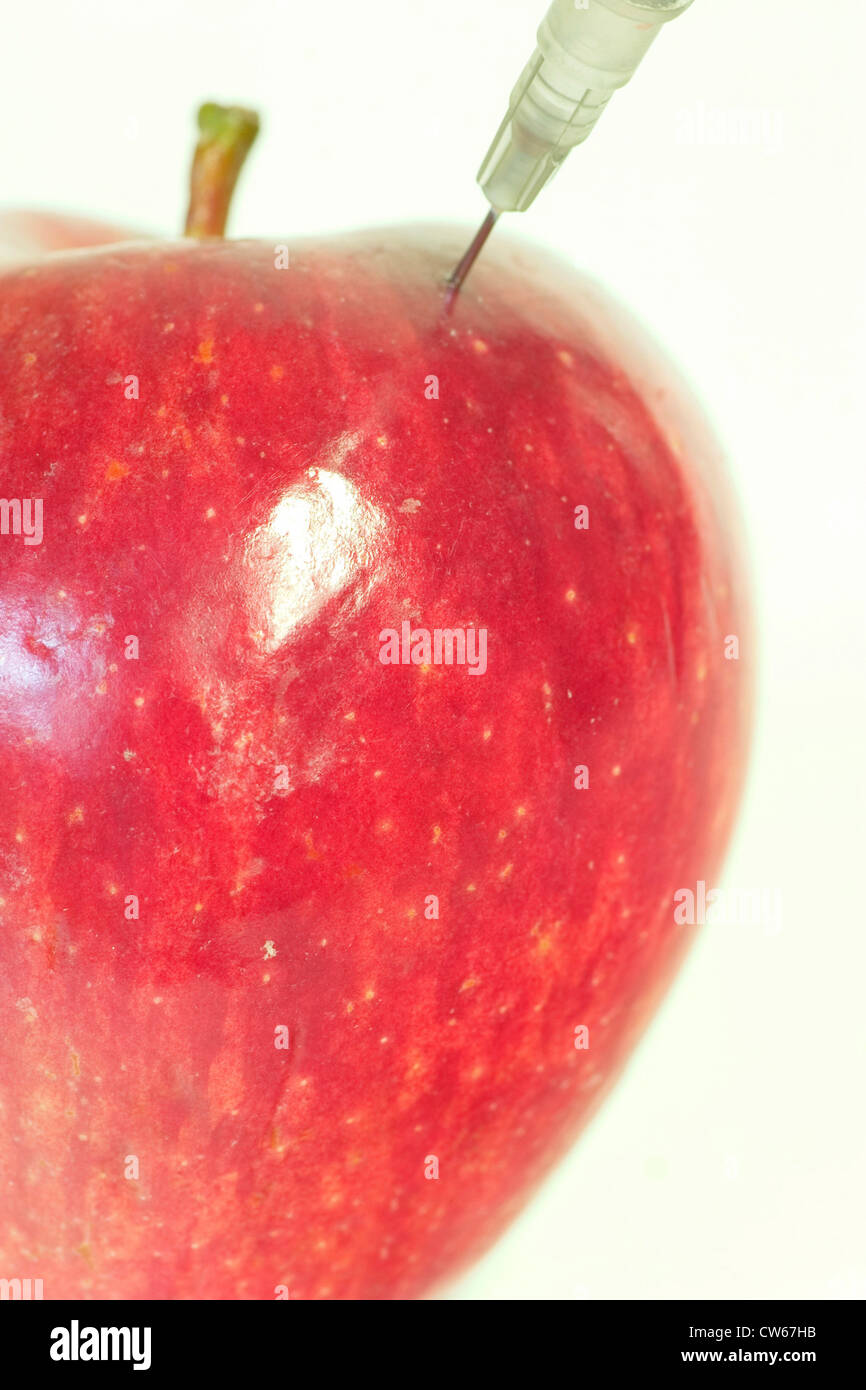 symbolic picture genetic engineering, apple with syringe Stock Photo ...