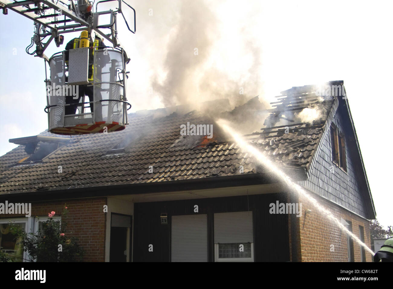 Fireman extinguishing building hi-res stock photography and images - Alamy