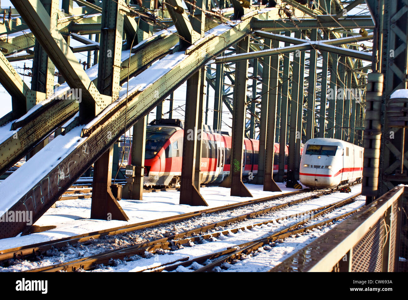 trains on the Hohenzollern bridge in snow, Germany, North Rhine ...