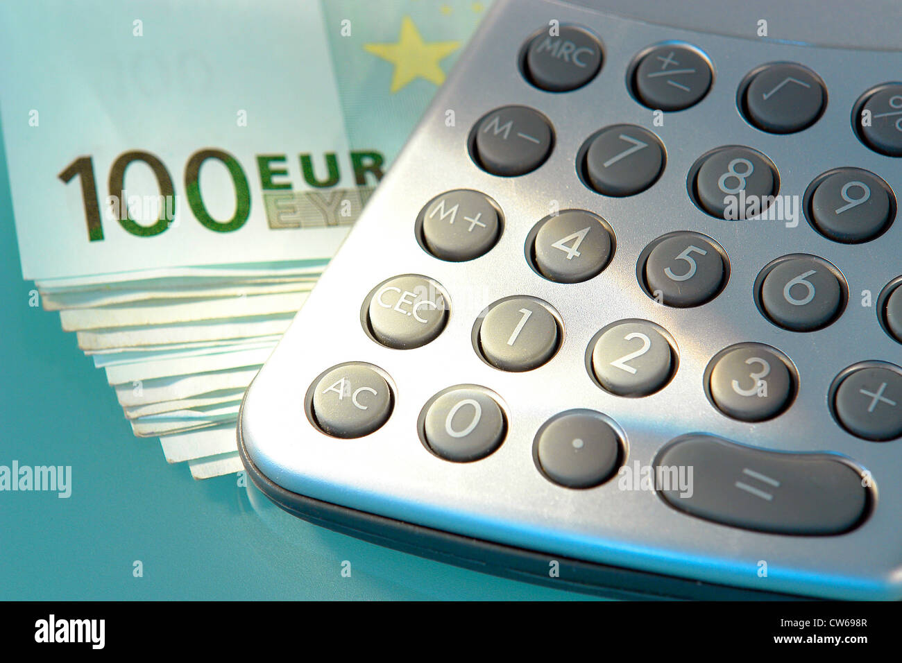 Euro banknote and calculator Stock Photo - Alamy