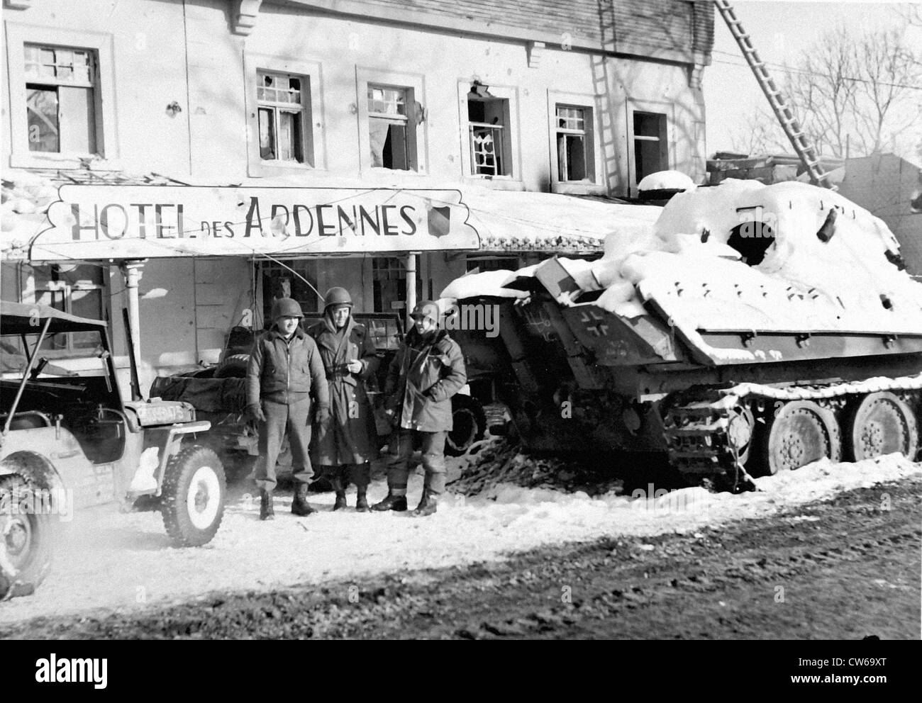 Officers of the 9th U.S Air Force in front of a disabled German tank ...
