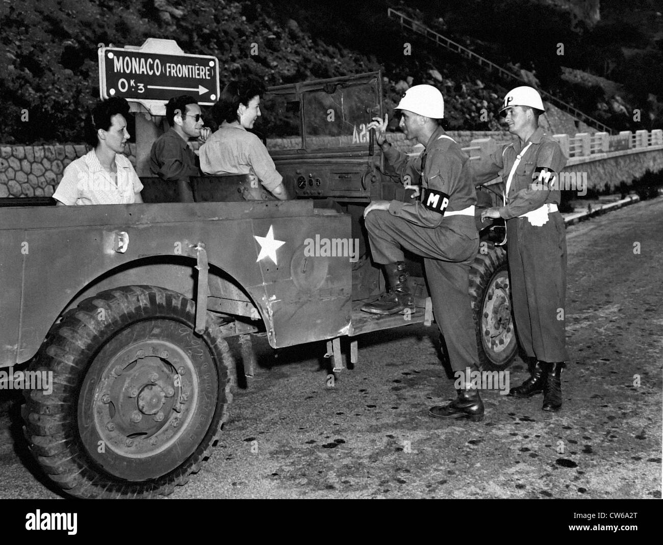 WACS at Monaco border talk with two M.Ps (June 30,1945 Stock Photo - Alamy